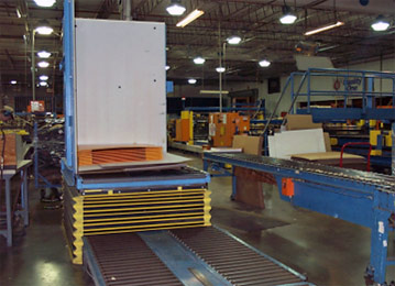 Manually stacking bundles of finished goods (typically flat corrugated ...